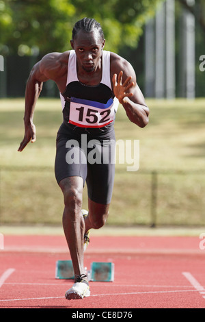 Man running from starting blocks Stock Photo - Alamy