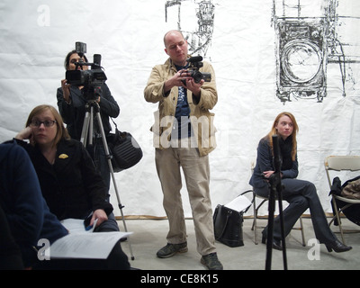 Videographer taping a political meeting, Brooklyn, New York Stock Photo ...