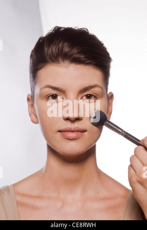 Foundation powder brush. Makeup applicator. Face paint. Apply ...