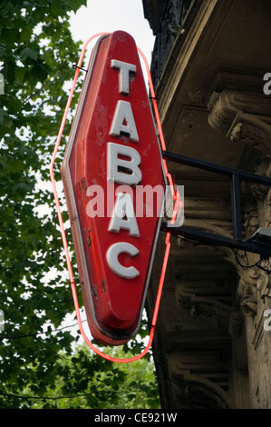 A french tobacconist or Tabac sign on a wll outside a shop in France ...