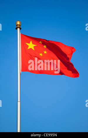 The chinese flag blowing in the wind in front of the Lingshan Grand ...