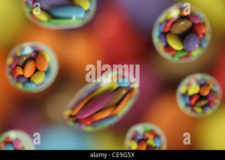 Coloured sweets through water droplets Stock Photo - Alamy