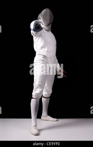 Male fencer isolated in a dark background Stock Photo - Alamy