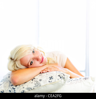 Portrait of smiling peaceful woman relaxing on lotus position sitting ...