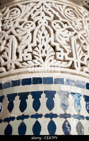 Traditional ornate plaster work and mosaic tiles with carved wooden ...