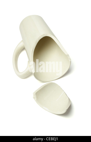 Broken tea cup isolated on red background. Cracked coffee mug and ...