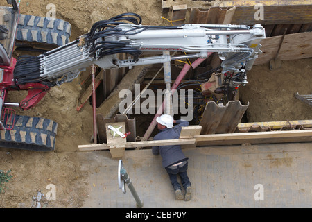 Road construction site UK trench with green ducts for cable TV and ...