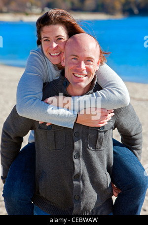 Beautiful and happy couple of just married has fun and fighting by ...