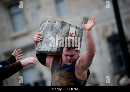 Basque rural sports. Harrijasotzaile, stone lifting, in the Santo Tomas ...