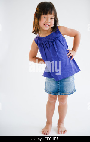 A vertical shot of a girl standing on a stone balcony with a Budapest ...