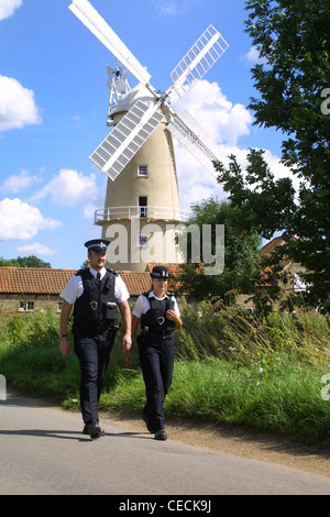 British Police officers patrolling rural area of Suffolk and talking to ...