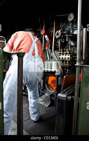 Fireman on Steam Train stoking the boiler. North York Moors Railway ...