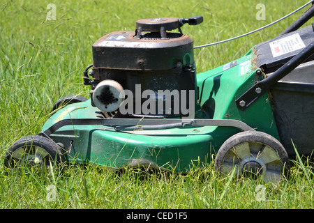 Lawn mower in long grass Stock Photo - Alamy