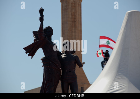 Lebanese flag and the Martyrs statue in the BCD, Place des Martyrs in ...
