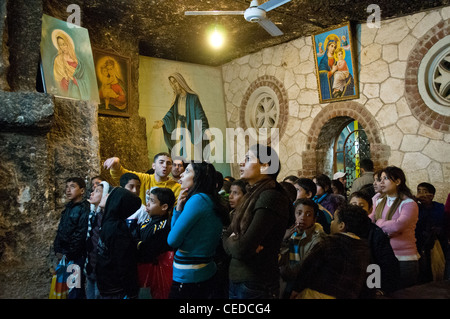 Young Coptic people praying at The Coptic Monastery in in Assiut Egypt ...