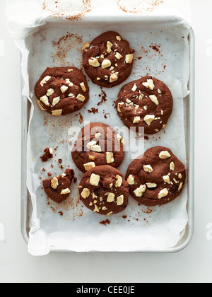 Baking tray with chocolate cookies on light background Stock Photo - Alamy