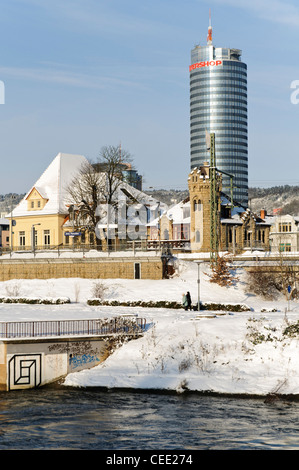 View of the snow-covered Jentower in Jena with mountains and forests in ...
