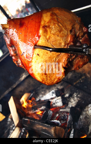 Pig on spit Stock Photo - Alamy
