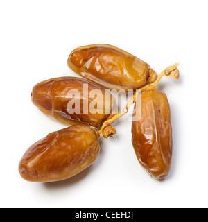 Dried dates on stalk, white background Stock Photo - Alamy