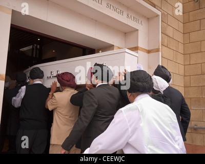 Sikh Funeral with Coffin being carried into the Crematorium Stock Photo ...