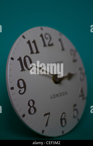 An old-fashioned analogue clock showing 10 to 3 Stock Photo - Alamy