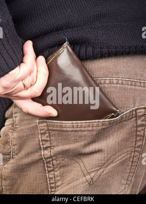 Theft of money from the back pocket, close-up Stock Photo - Alamy