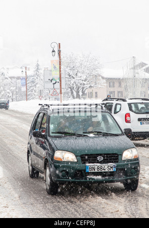 Cars driving in bad weather conditions with fog and heavy rain on city ...