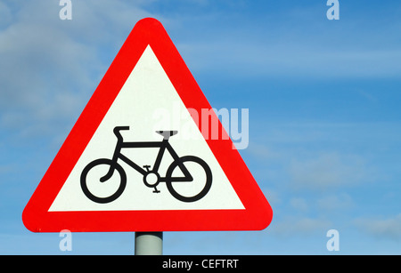 british red and white triangular road sign warning cyclists to go slow ...