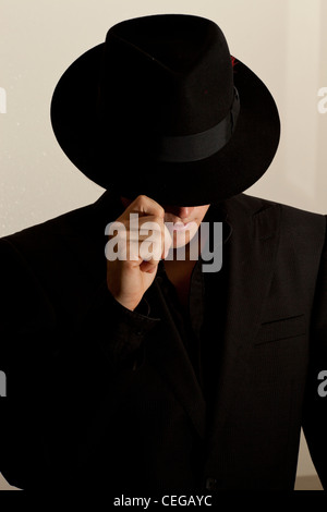 Man tipping hat Stock Photo - Alamy