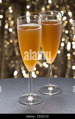 Champaign glass in front of gold glitter background Stock Photo - Alamy