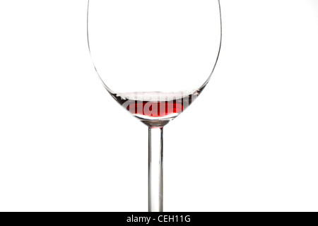 Almost empty glass of red wine put on a wooden window sill Stock Photo ...