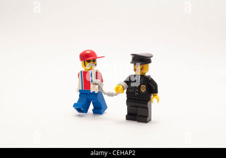 Lego policeman arresting a criminal Stock Photo - Alamy