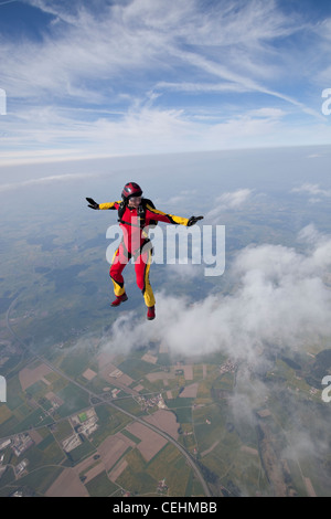 Skydiver is practice the sit position and flying free over nice ...