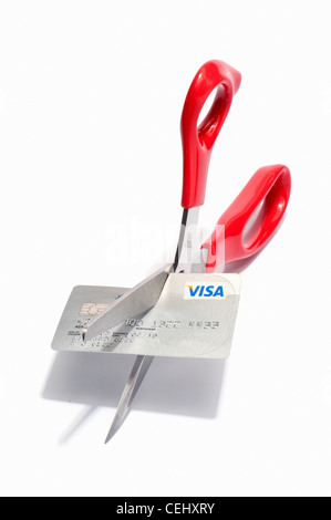 Scissors cutting up a visa credit card Stock Photo - Alamy