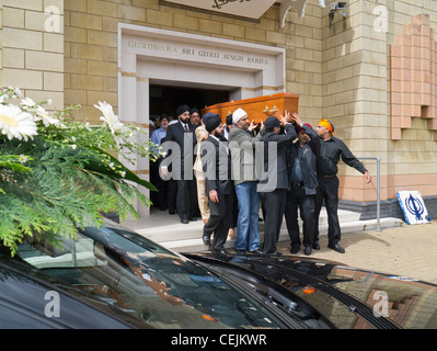 Sikh Funeral with Coffin being carried into the Crematorium Stock Photo ...