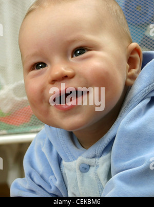 Male baby looking up smiling Stock Photo - Alamy