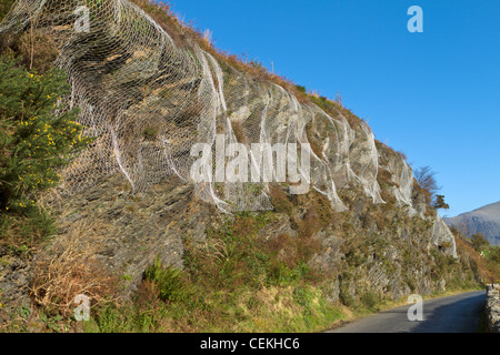 Netting to prevent rocks falling onto road Stock Photo - Alamy