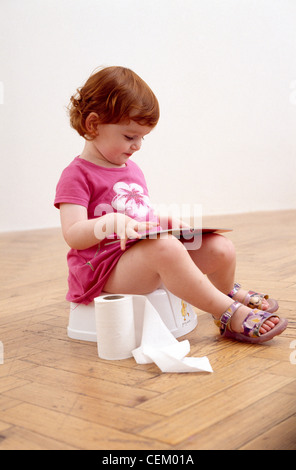 Female toddler ginger hair wearing a short pink dress and sandals ...