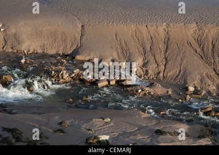 sand and mud banks with rocks at low tide Stock Photo - Alamy