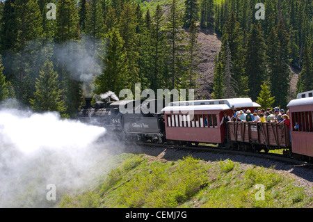 Cumbres & Toltec Scenic Railroad train crosses the Chama River behind ...