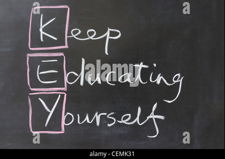 Chalk drawing - Keep educating yourself blackboard Stock Photo - Alamy