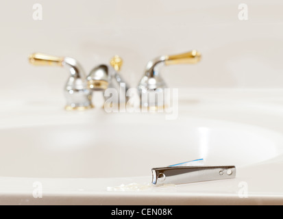 Finger nail clippings on bathroom sink Stock Photo - Alamy