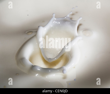 Shapes created by drops of milk and milk splashes Stock Photo - Alamy