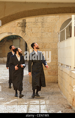 Observant Orthodox Jewish men on their way to pray at the Wailing Wall ...