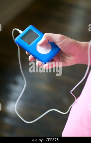 Woman using Apple Ipod Stock Photo - Alamy