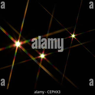 colorful flashy spotlight star made with optical star filter on camera ...