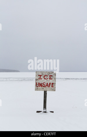A sign that reads danger, thin ice Stock Photo - Alamy