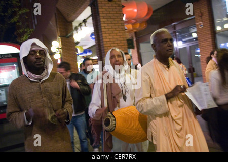 A group of Hare Krishna followers singing and chanting their way along ...
