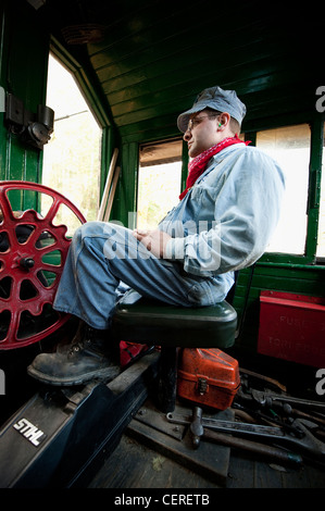 A train engineer driving an antique diesel locomotive on the Lake ...