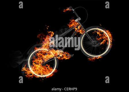 Bike in fire on black and red background Stock Photo - Alamy